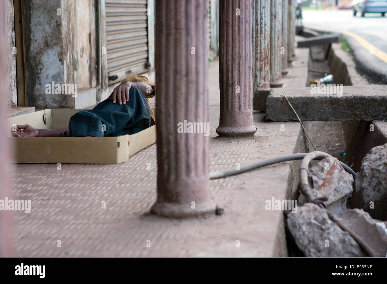 Homeless laying in box on the street of Panaji, Goa, India Stock Photo ...