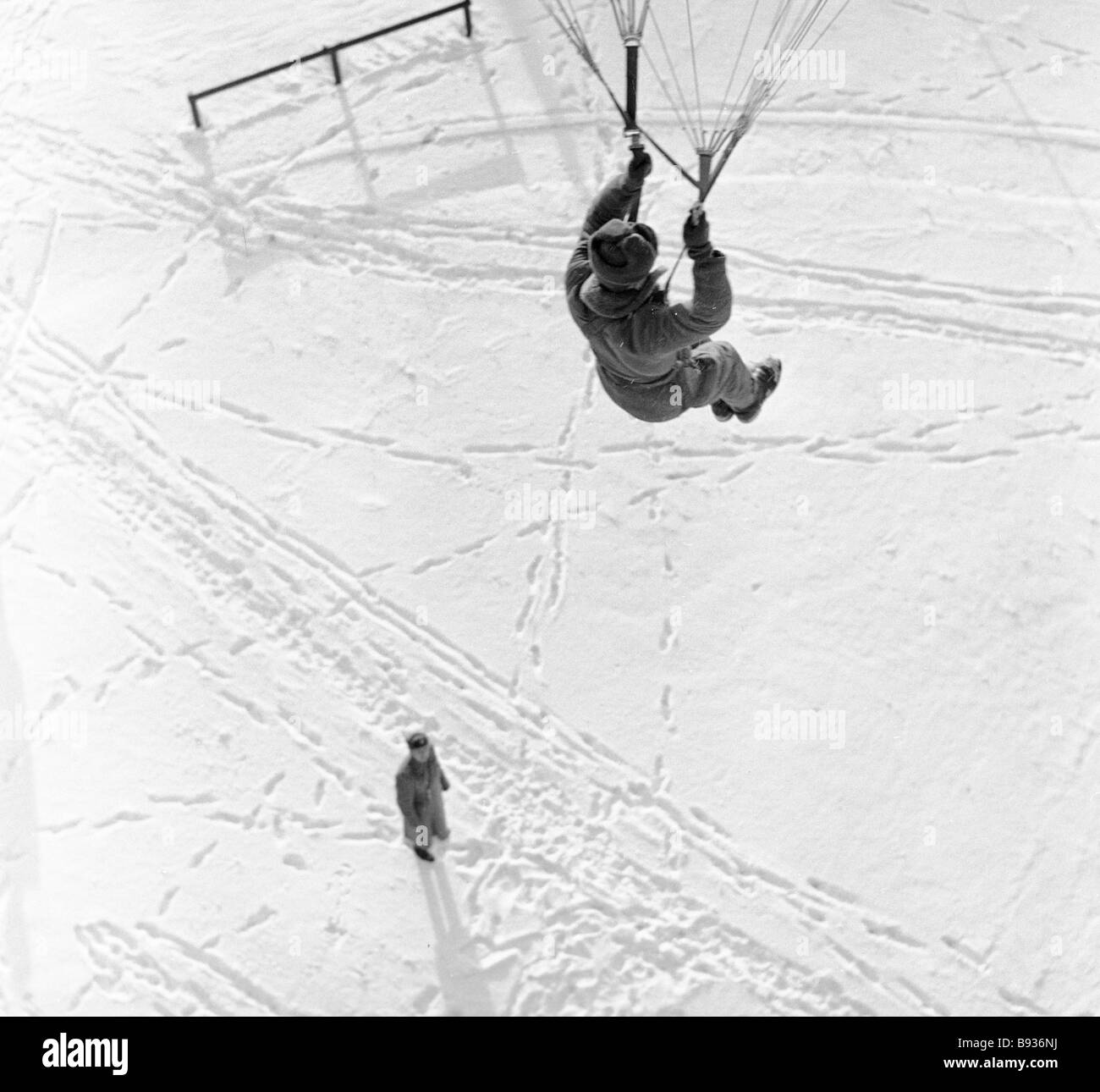 A paratrooper parachuting from a tower Stock Photo - Alamy