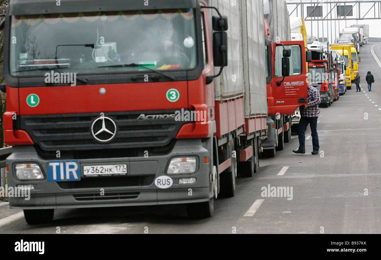 A line of loaded trucks waiting for customs clearance at Dorohust on ...