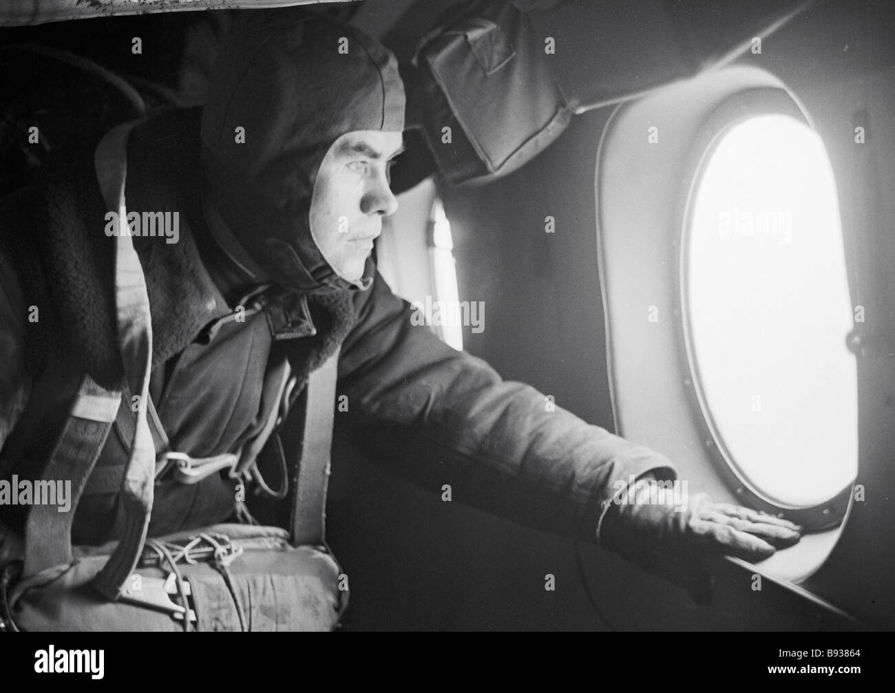 A cadet of the Lenin Komsomol higher aviation school looking out of the ...