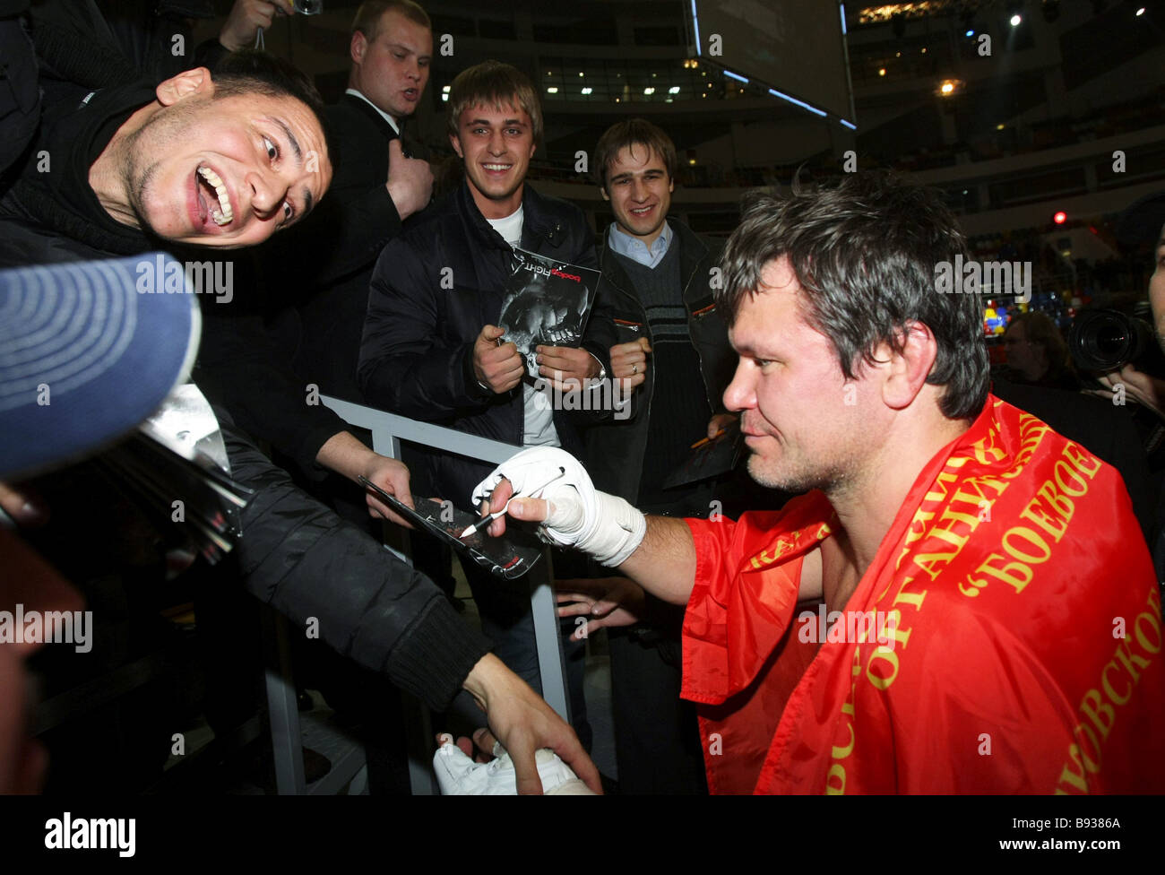 Russian wrestler Oleg Taktarov signing an autograph after a heavyweight ...