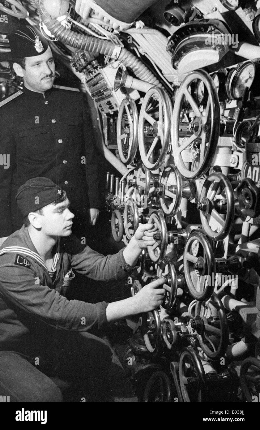 A petty officer and a seaman in the submarine engine room Stock Photo ...