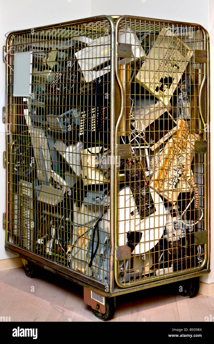 Wire container filled with electronic rubbish Stock Photo - Alamy