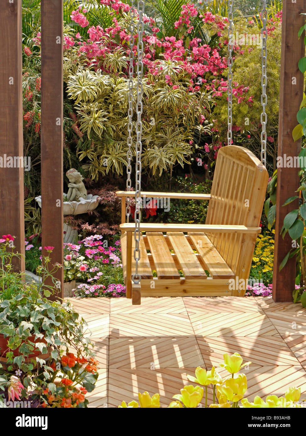 Wooden garden swing Stock Photo - Alamy