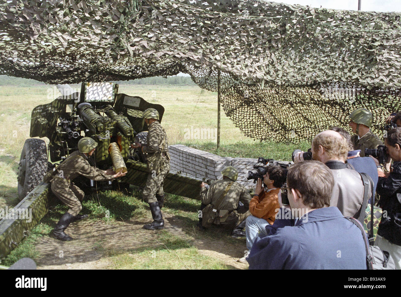 Soviet and foreign journalists watch a firing drill during tactical ...