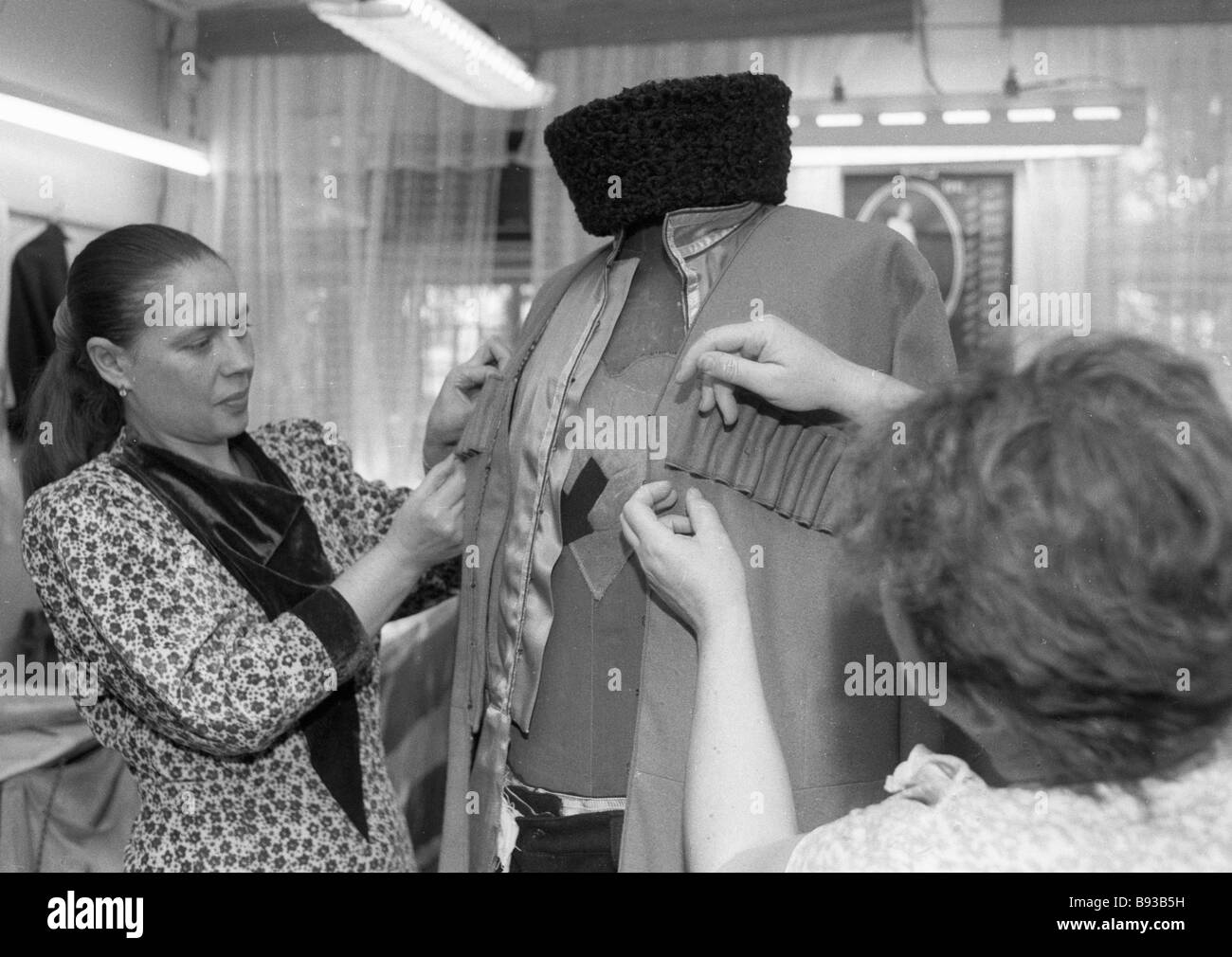 Tailoring a traditional Cossack outfit at a theatre studio Stock Photo ...