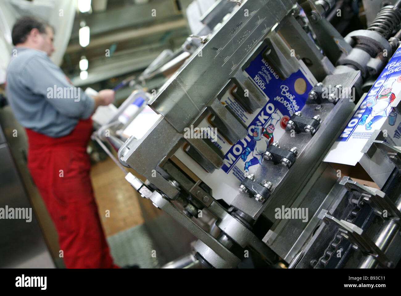 Milk packing conveyor at the Sibirskoye Moloko dairy plant in ...