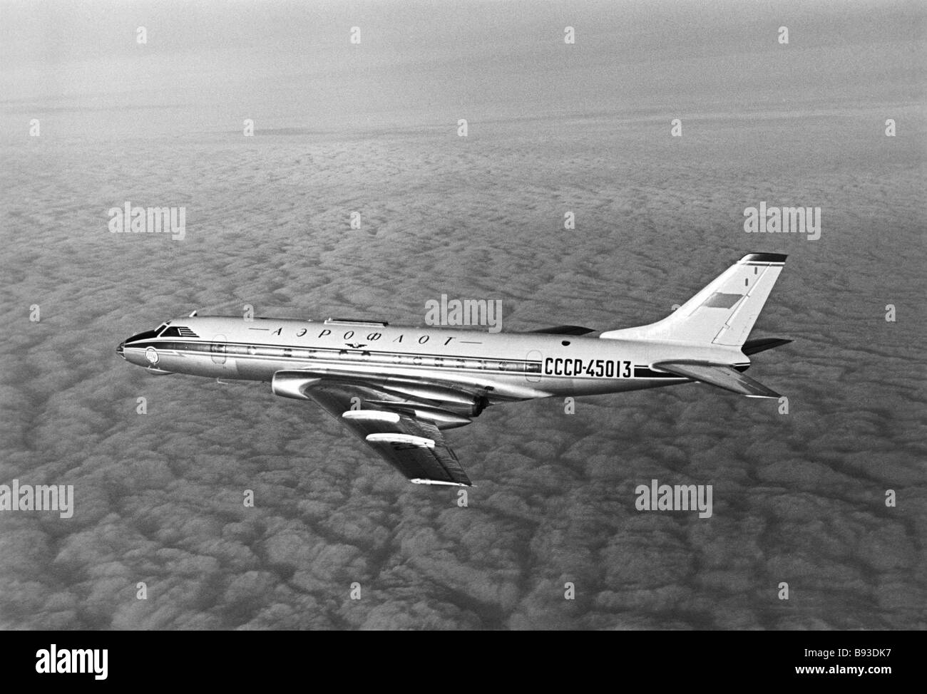 Passenger plane TU 124 on flight above the clouds Stock Photo - Alamy