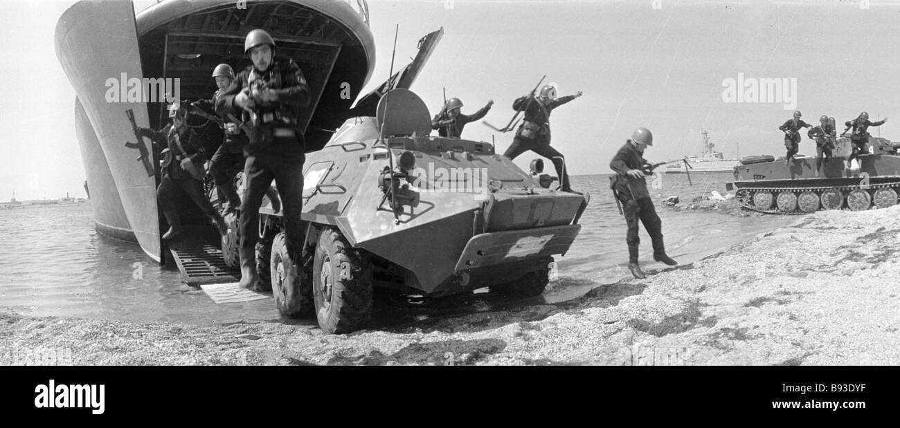 Marines and armored vehicles disembarking from the ship s hold onto the ...