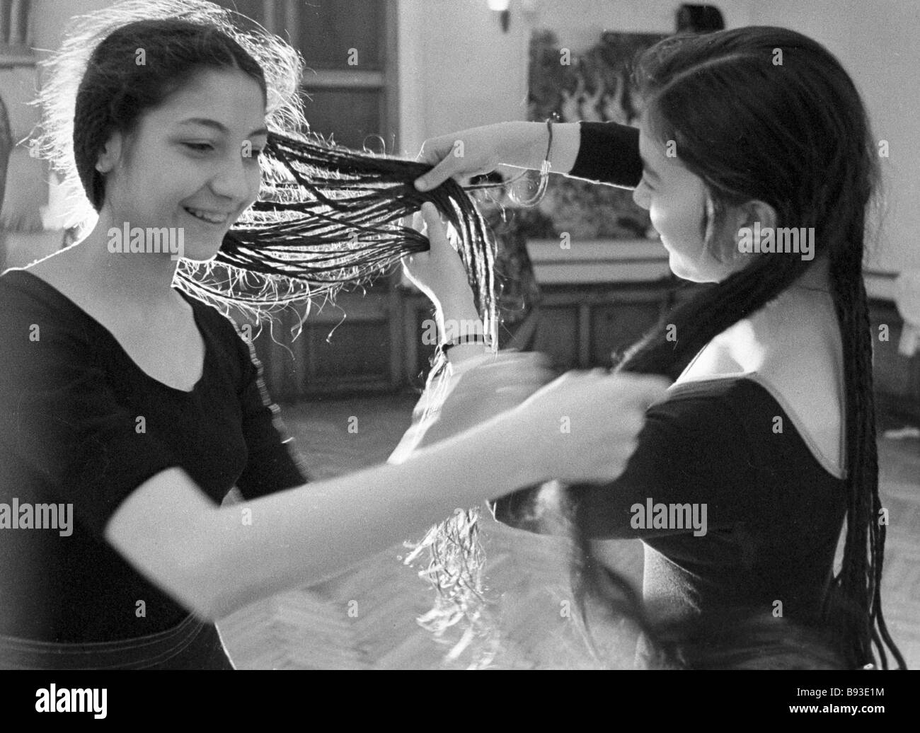 Uzbek girls braiding their hair Stock Photo - Alamy