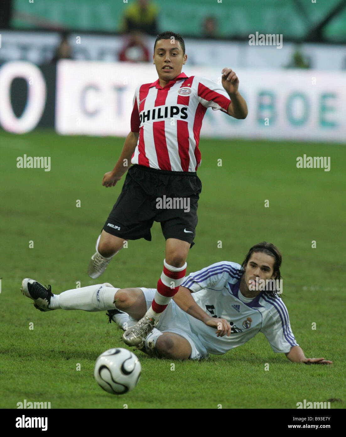 Holland player Ismail Aissati and Real footballer Fernando Gago dowm ...