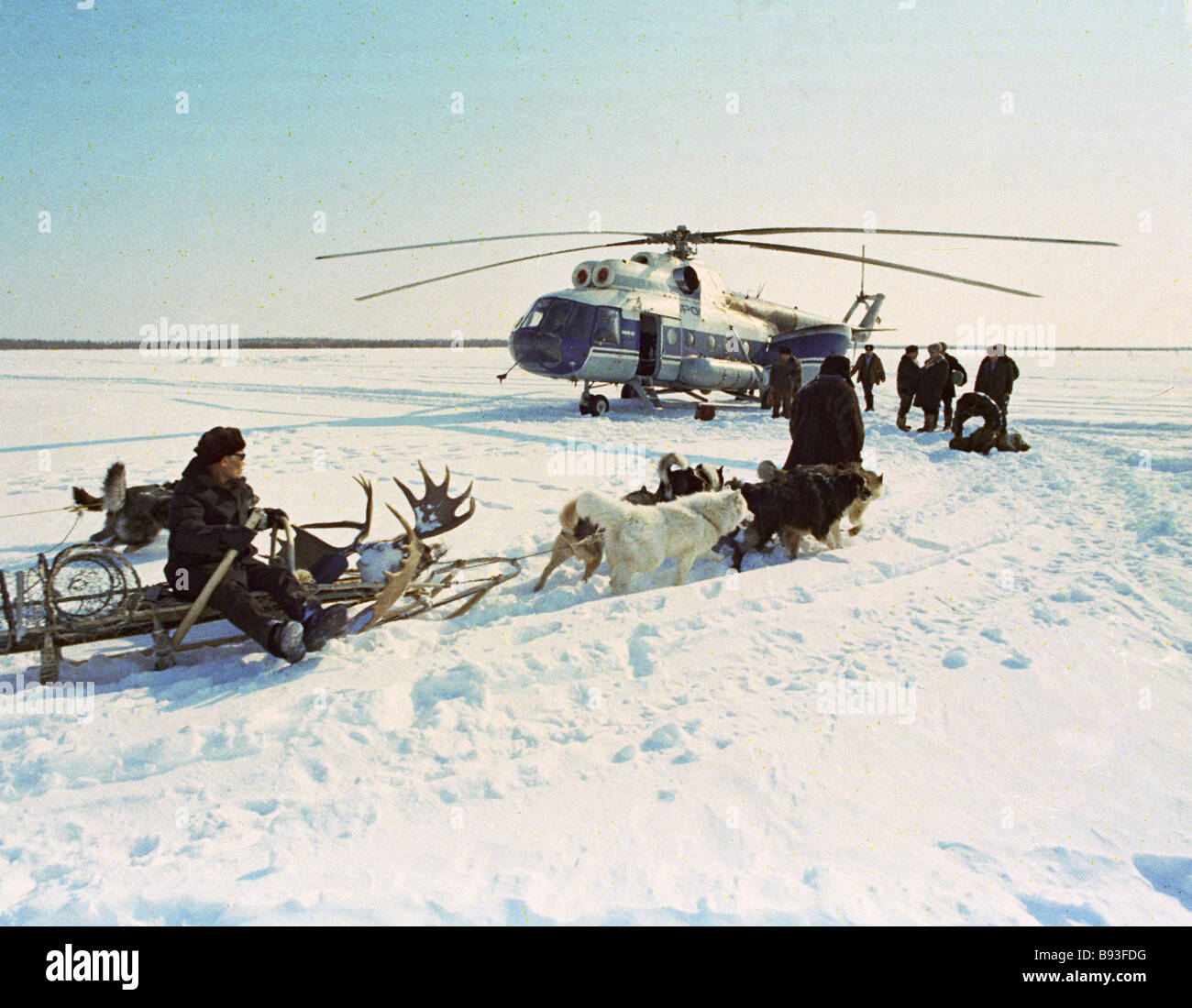 Yakut hunters get out of a helicopter that delivered them t the hunting ...