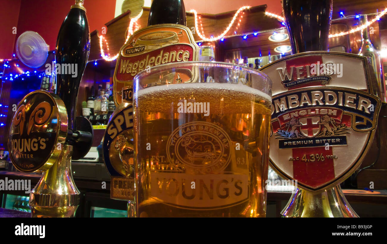 Real ale beer pumps on a typical pub bar London England Stock Photo - Alamy