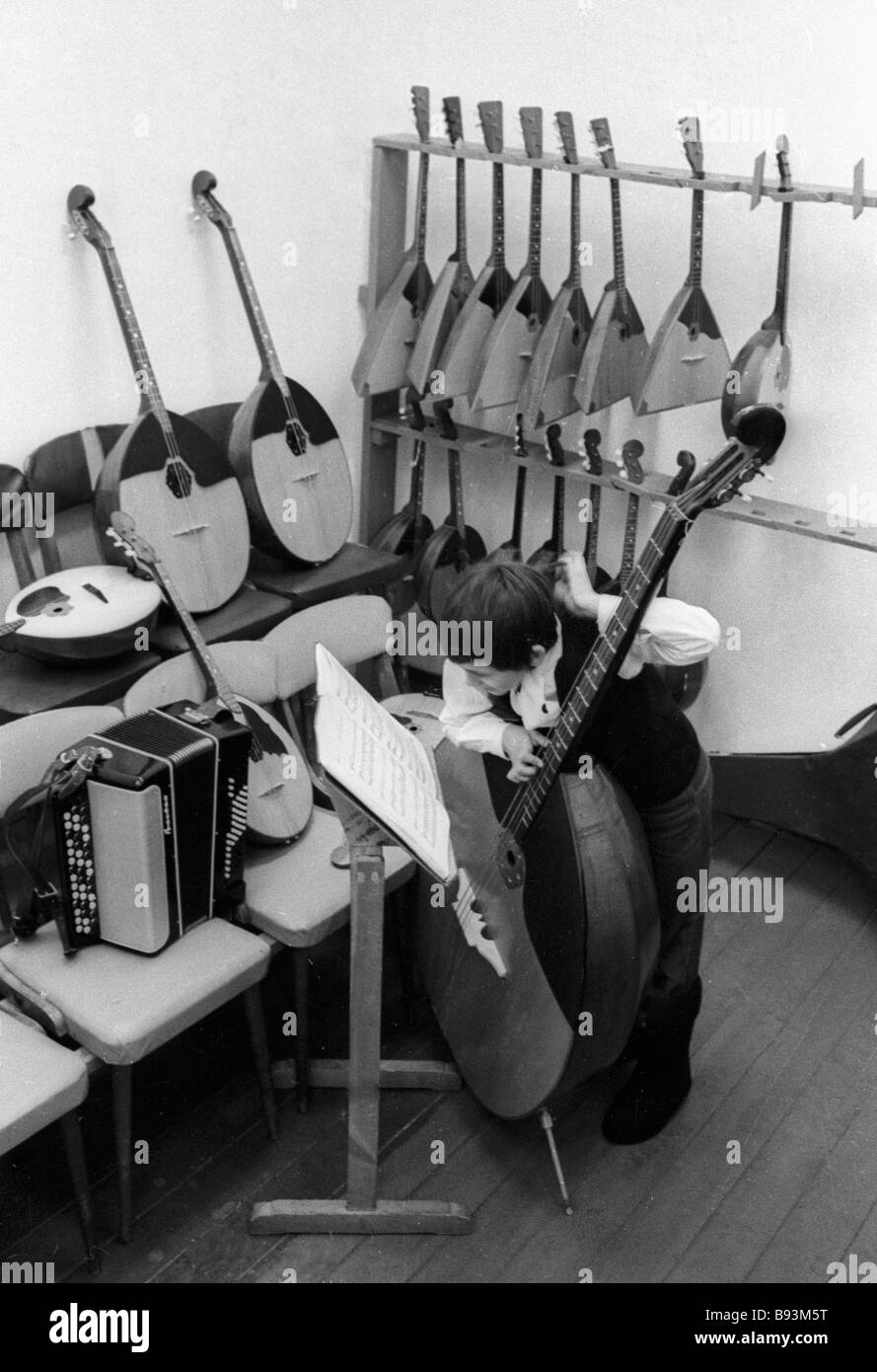 A pupil of the folk musical instrument studio at a lesson Stock Photo ...