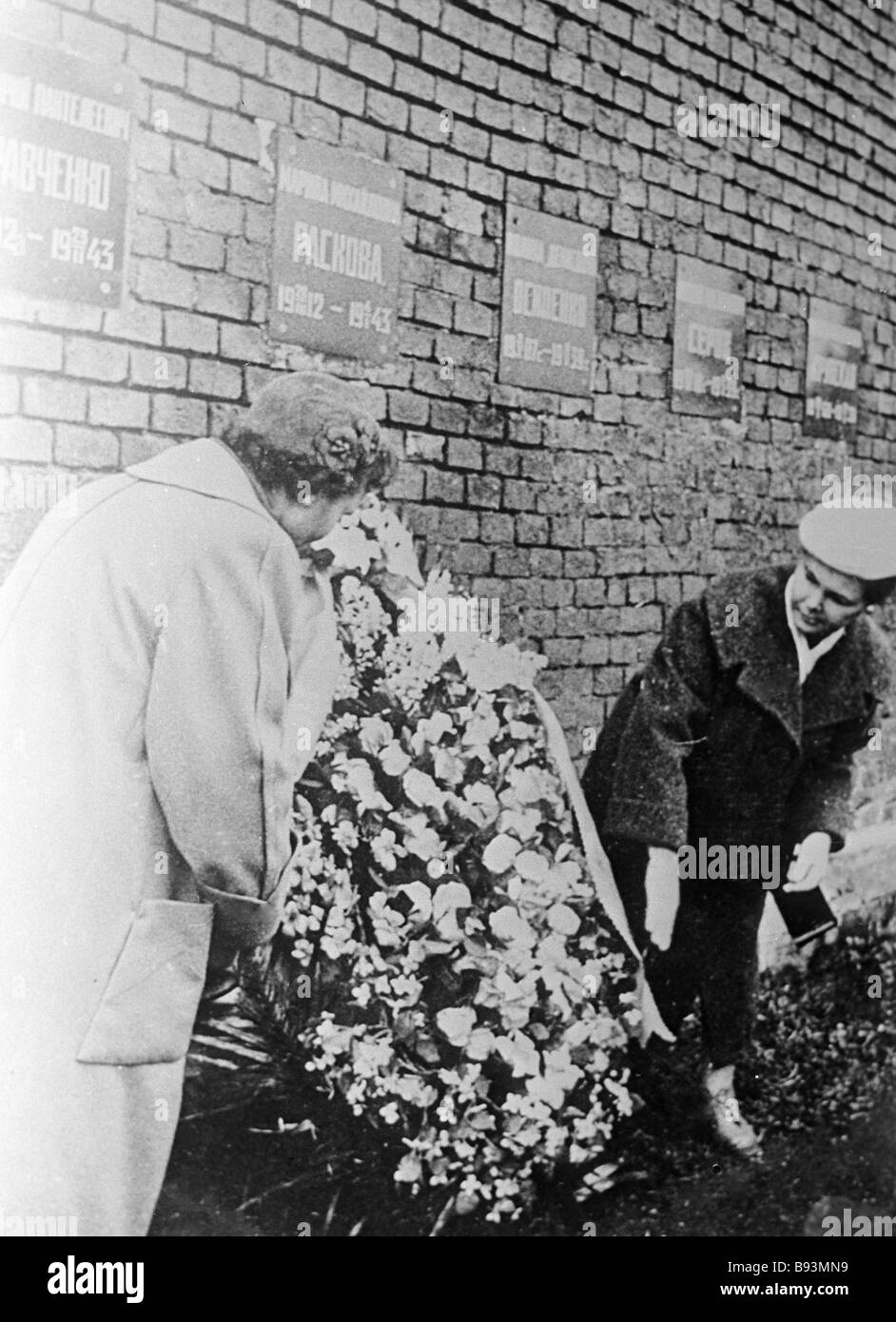 Veteran pilots Tamara Pamyatnykh left and Galina Burdina lay flowers to ...