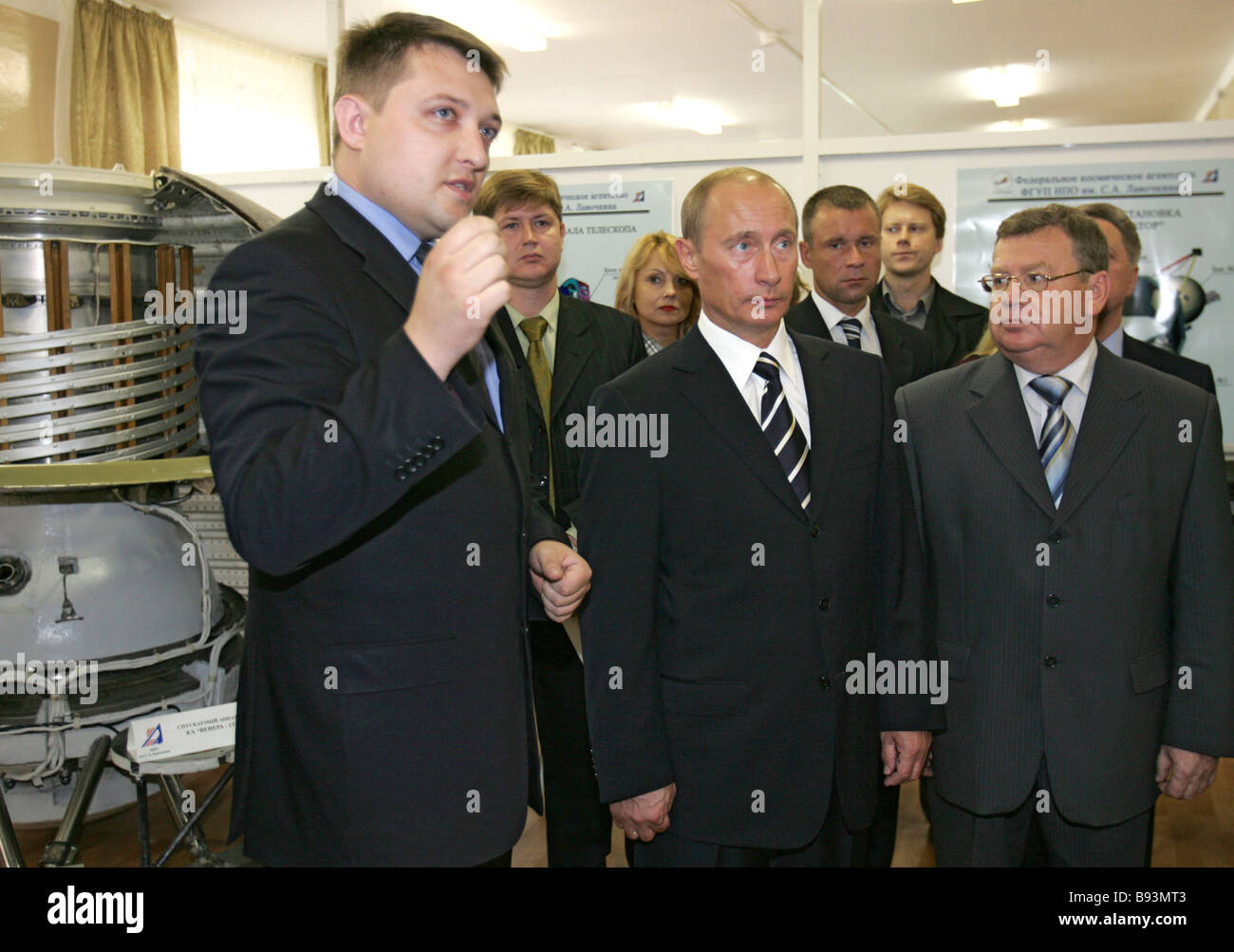 Director of the Khimki technical school Vladimir Bolshakov and President Vladimir Putin right to ...