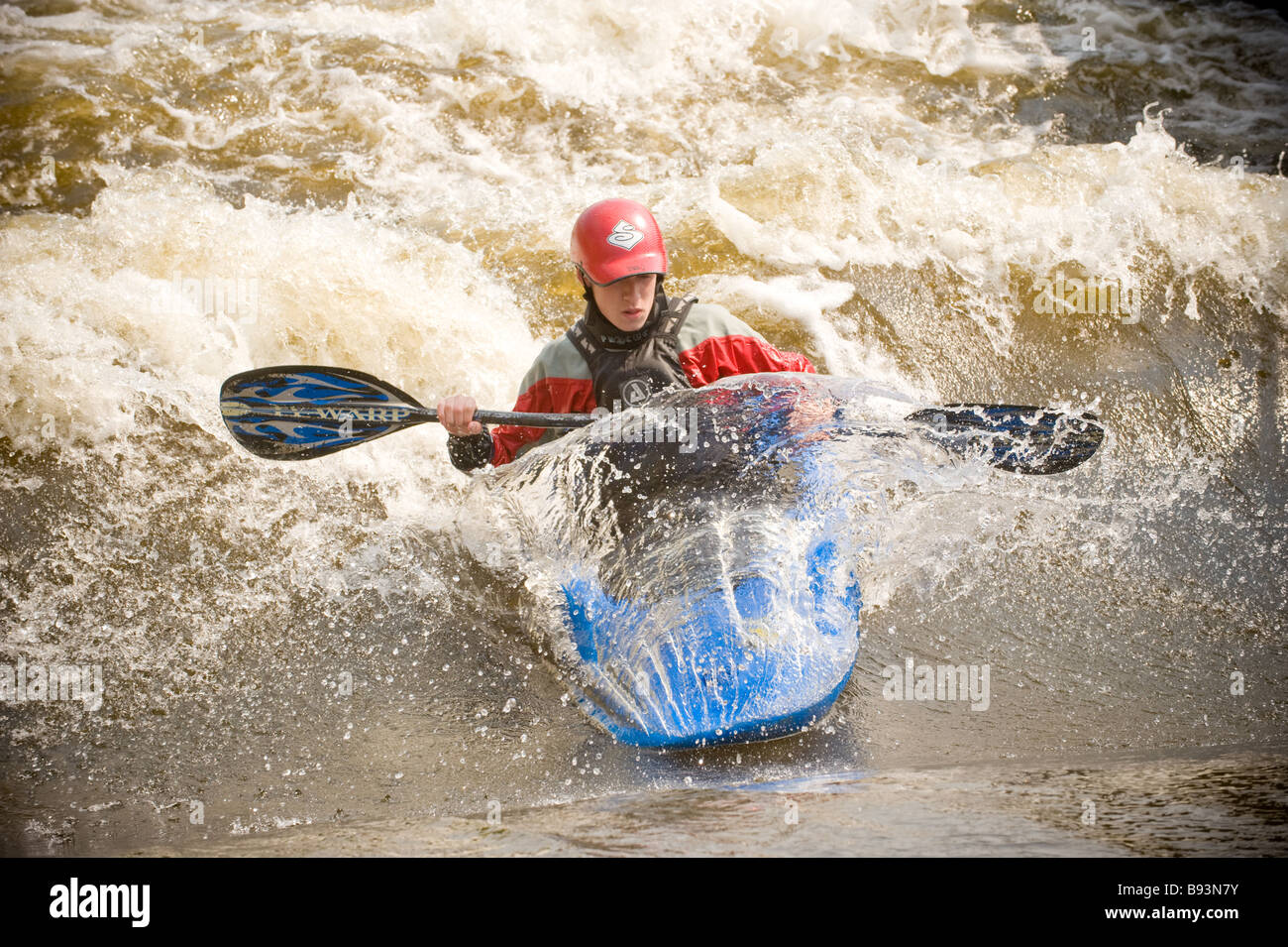 Front view of a young caucasian kayaker in a blue playboat at Tees ...