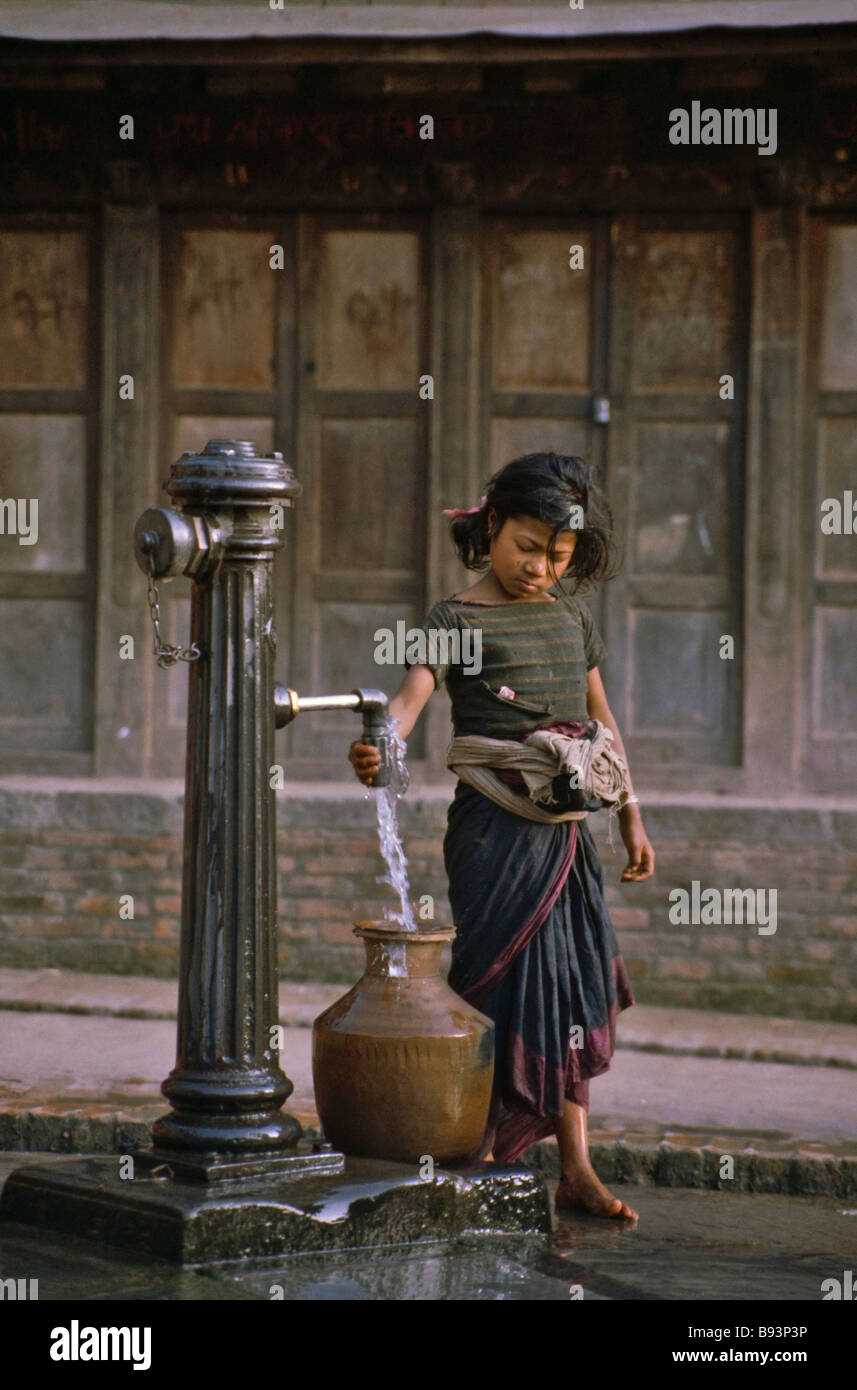 Young girl filling water jar Bhaktapur Nepal Stock Photo - Alamy