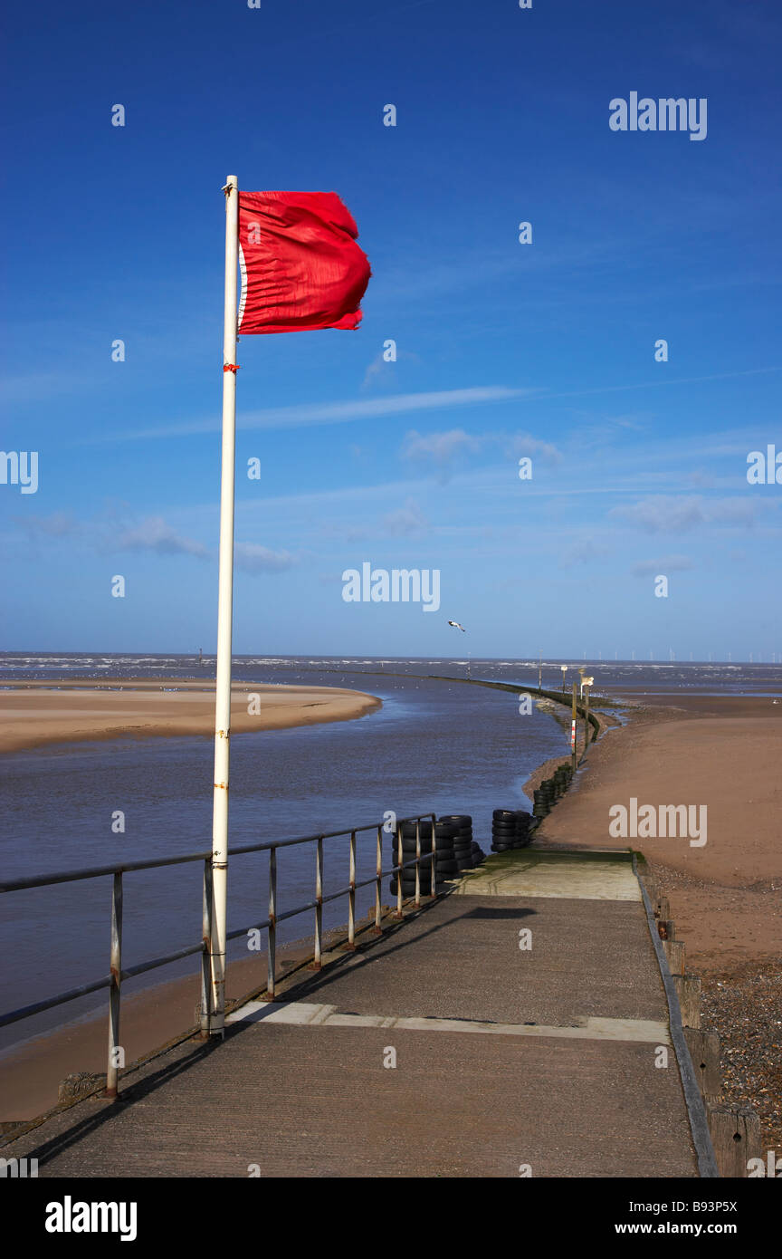 Red warning flag on seaside Stock Photo - Alamy