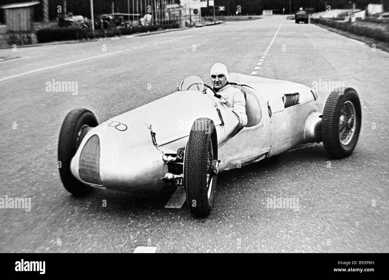 Chairman of antique cars club at the wheel of 1936 Auto Union racing ...