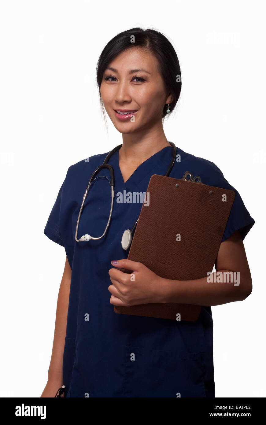 Young brunette asian woman health care worker wearing blue scrubs with ...