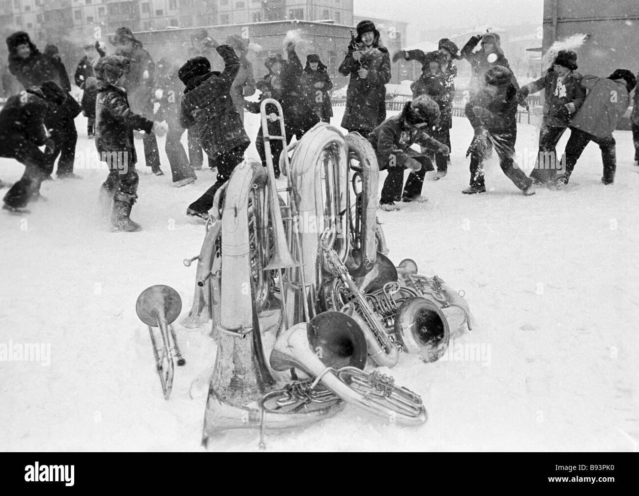 Children s brass band performers have a snowball fight after concert ...