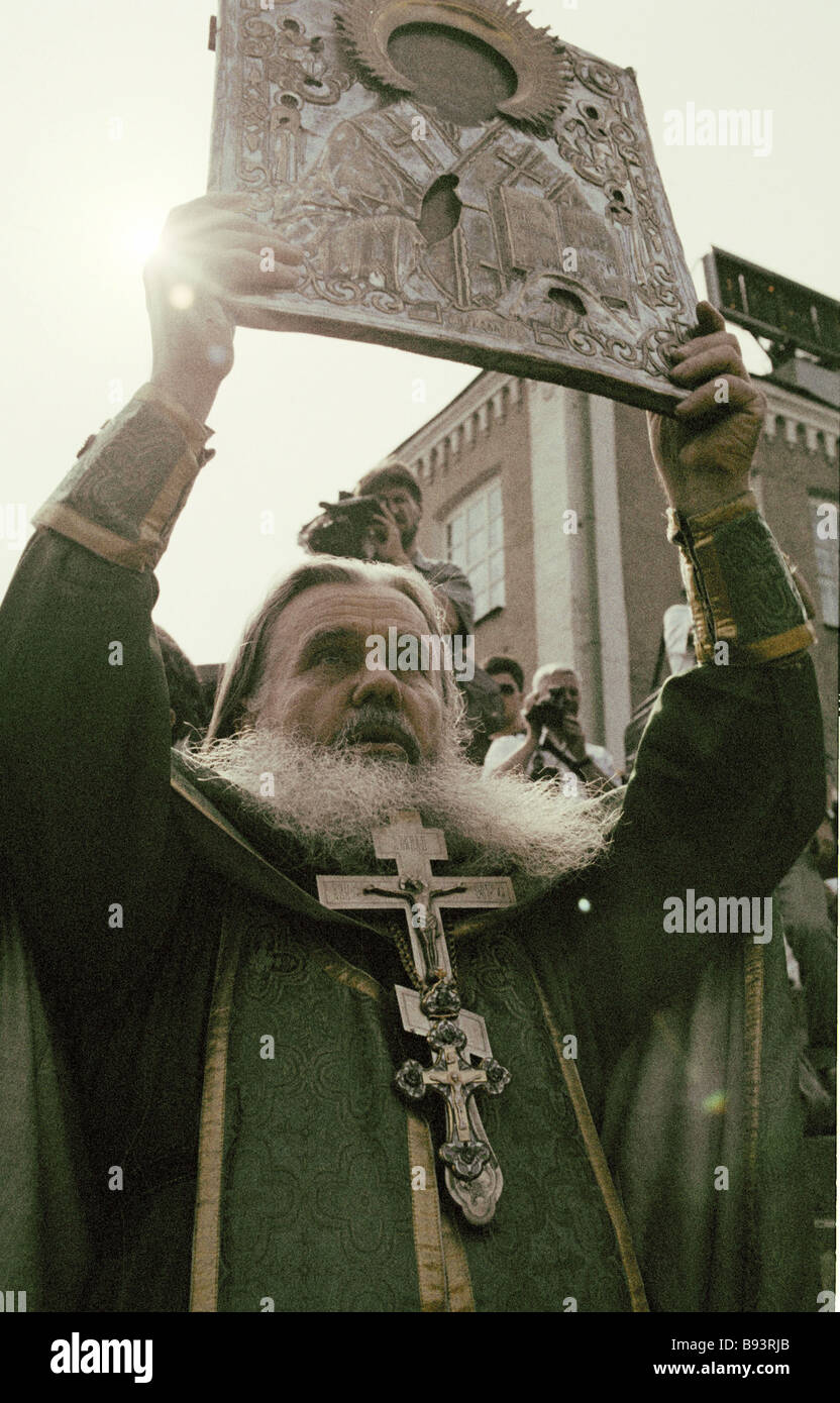 A churchman blesses a copy of Peter s boat Fortuna before launch ...