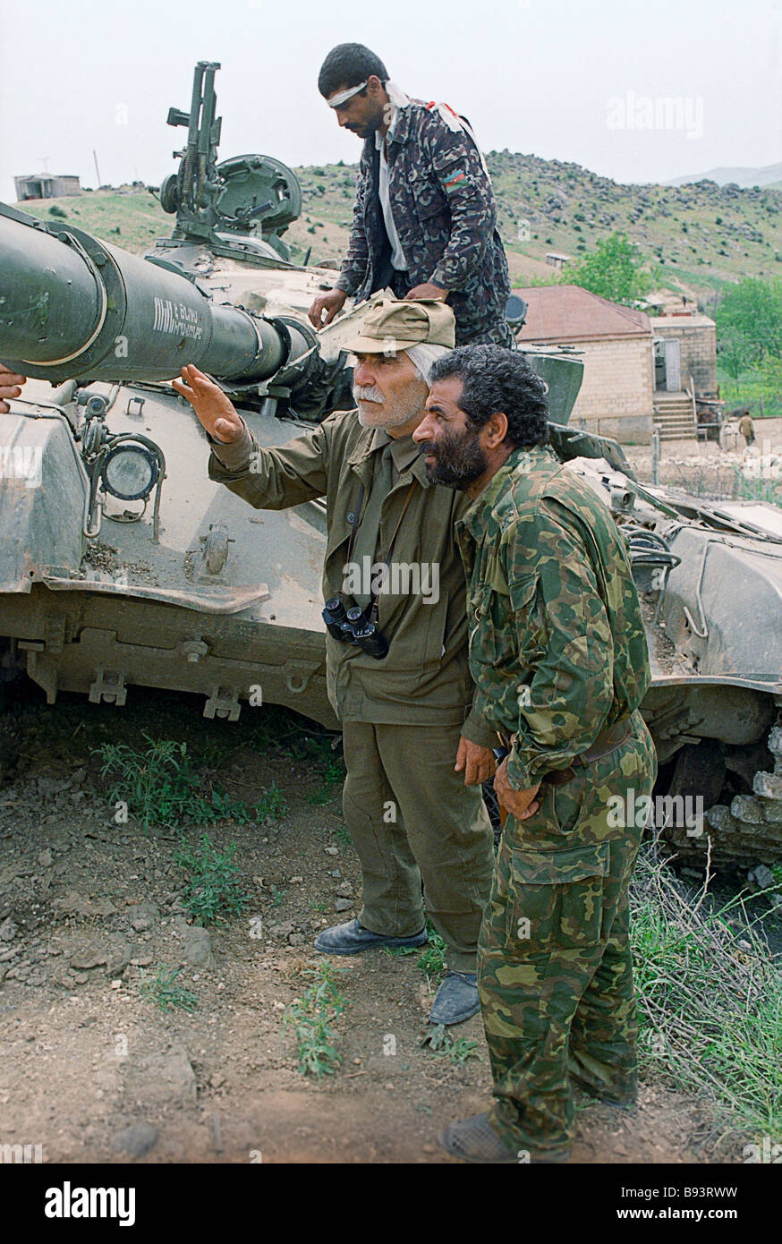 Members of Azeri armed units posing next to a knocked-out Armenian T-72 ...