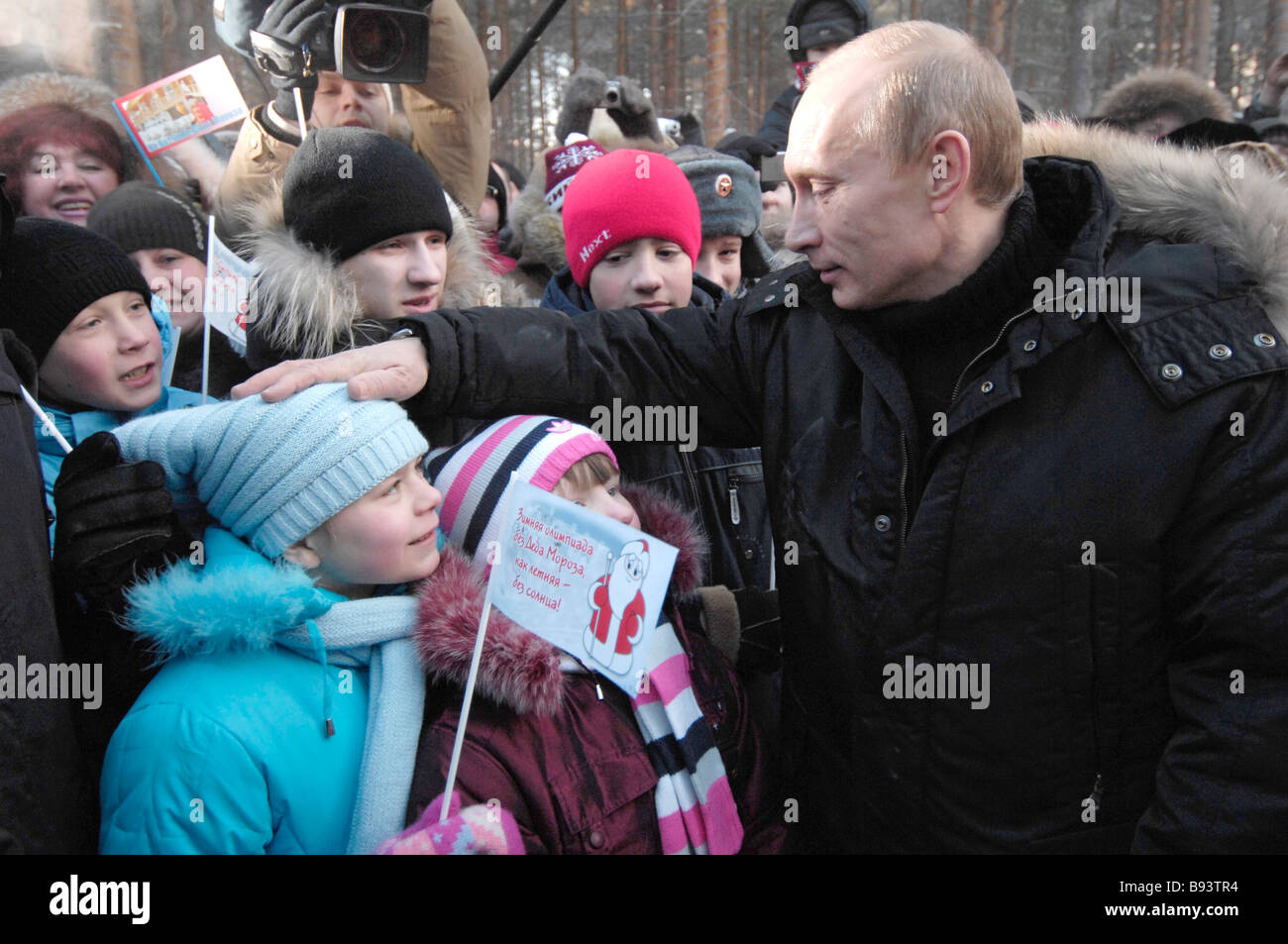 President Vladimir Putin meeting with children outside the home of ...