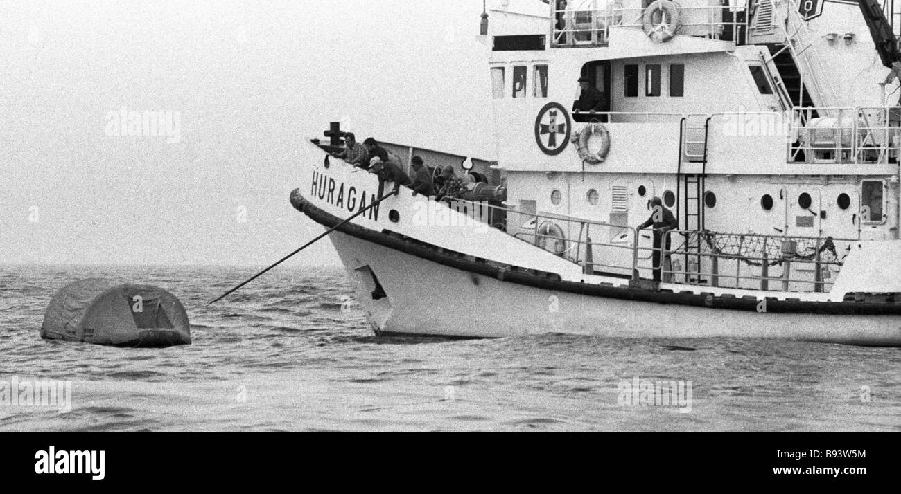 The Polish rescue ship Uragan pulling toward its board the rescue raft ...