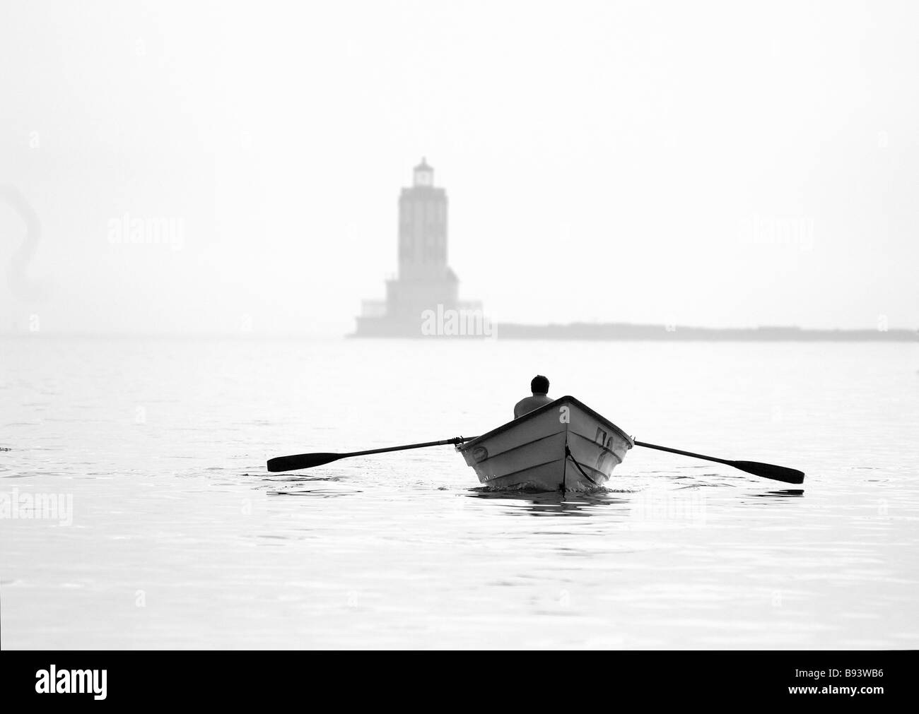 Lonely boat ocean Black and White Stock Photos & Images - Alamy