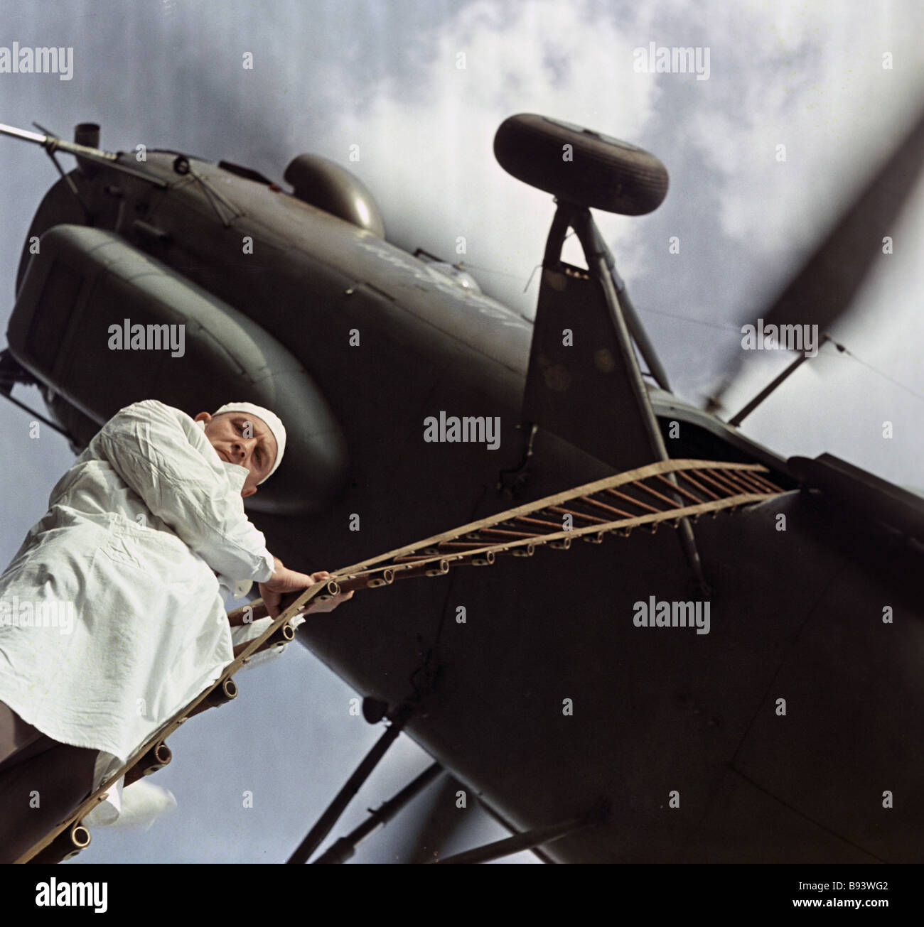 Ambulance aviation physician climbing the rope ladder to get on board ...