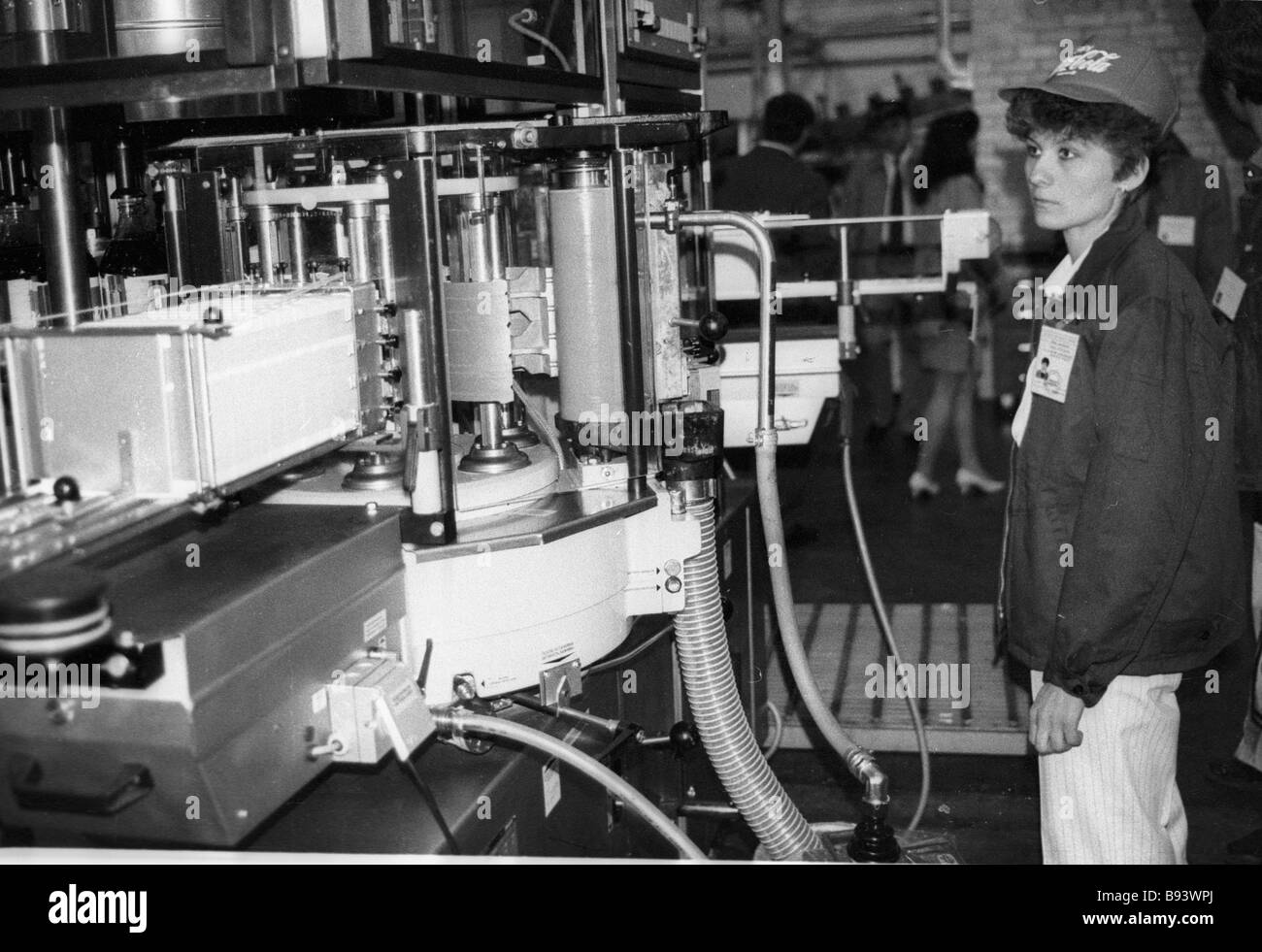A staff member from Coca Cola production facility monitors the ...