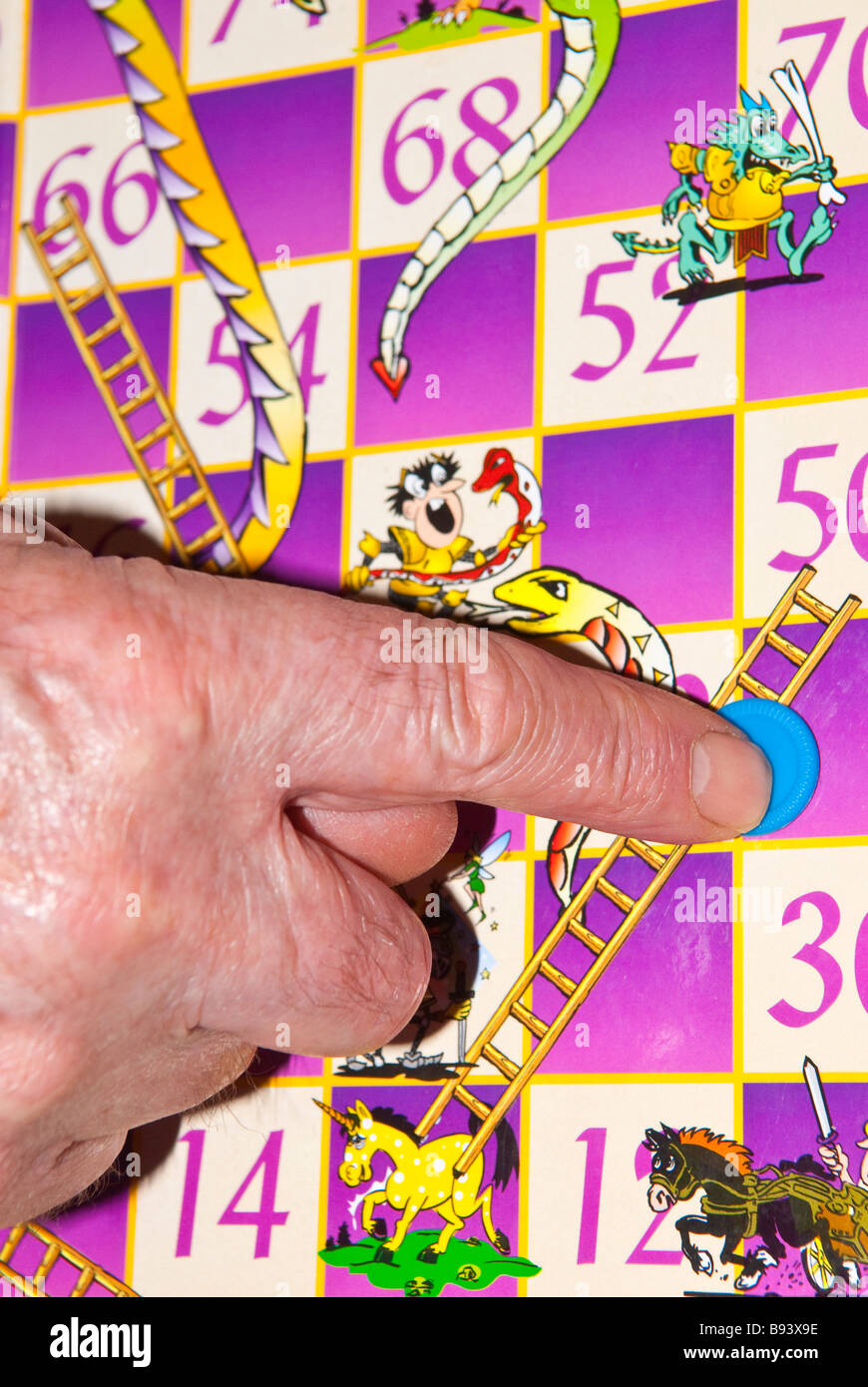 Playing snakes and ladders hi-res stock photography and images - Alamy