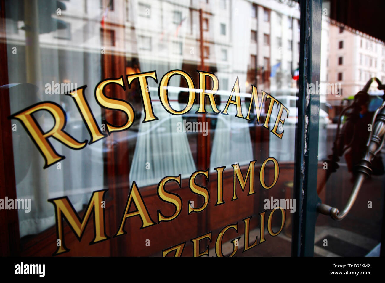 Gold painted restaurant sign in window of Rome restaurant Stock Photo ...
