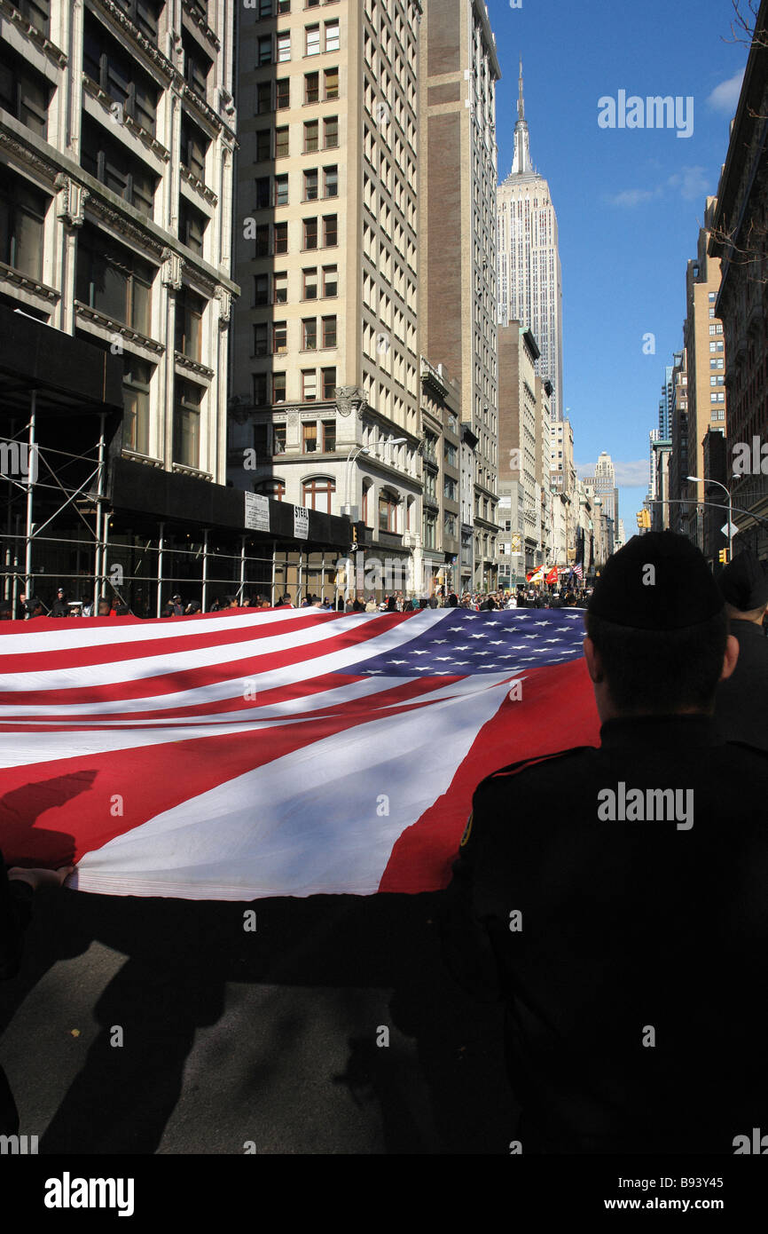 Huge flag being carried by a large group of men in a G.A.R. parade in ...