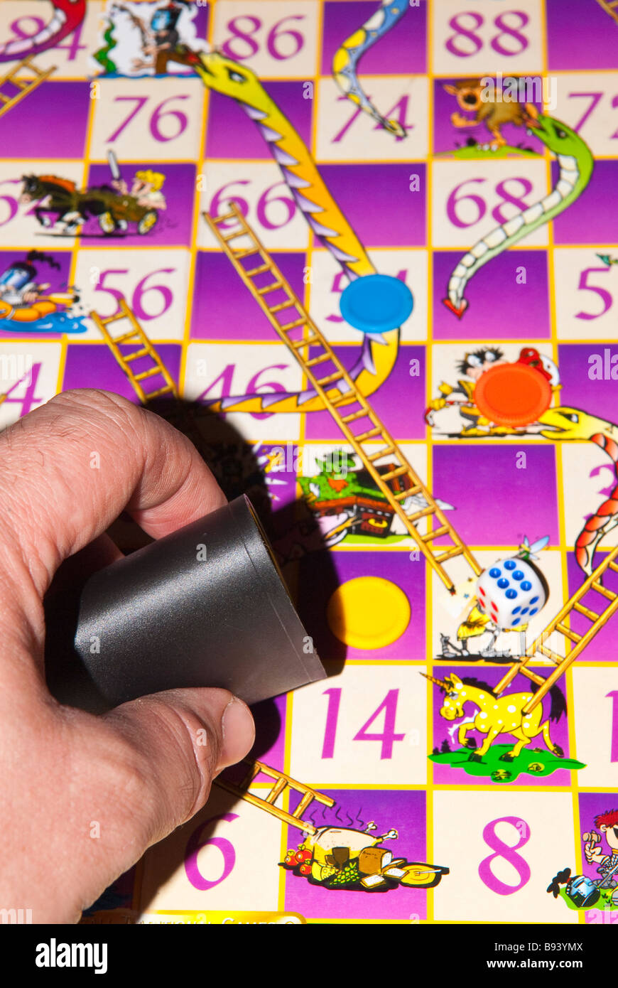 Children playing snakes and ladders hi-res stock photography and images ...