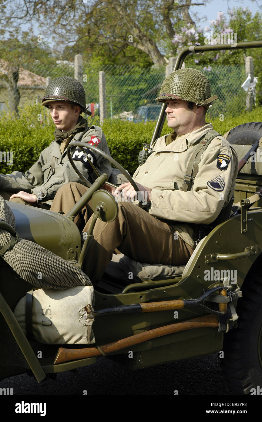 Two Us GI soldiers in a military Jeep for a re-enactment during a ...