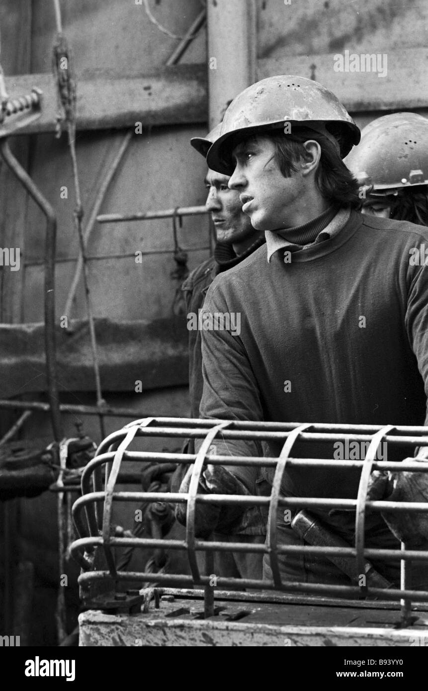 A foreman supervising oil rig works at Novy Uzen oil field Stock Photo ...