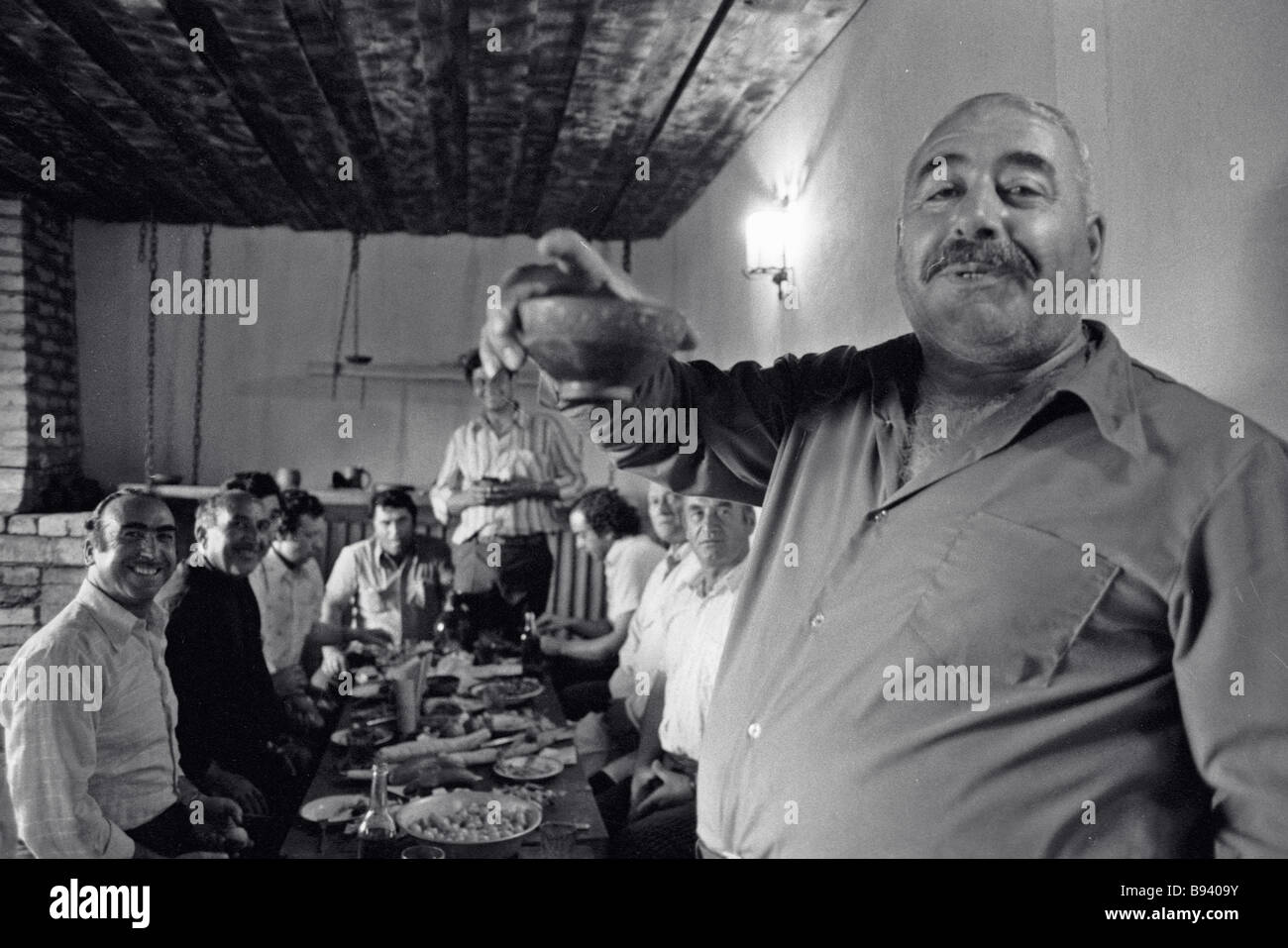 A toastmaster at a traditional Georgian banquet Stock Photo - Alamy