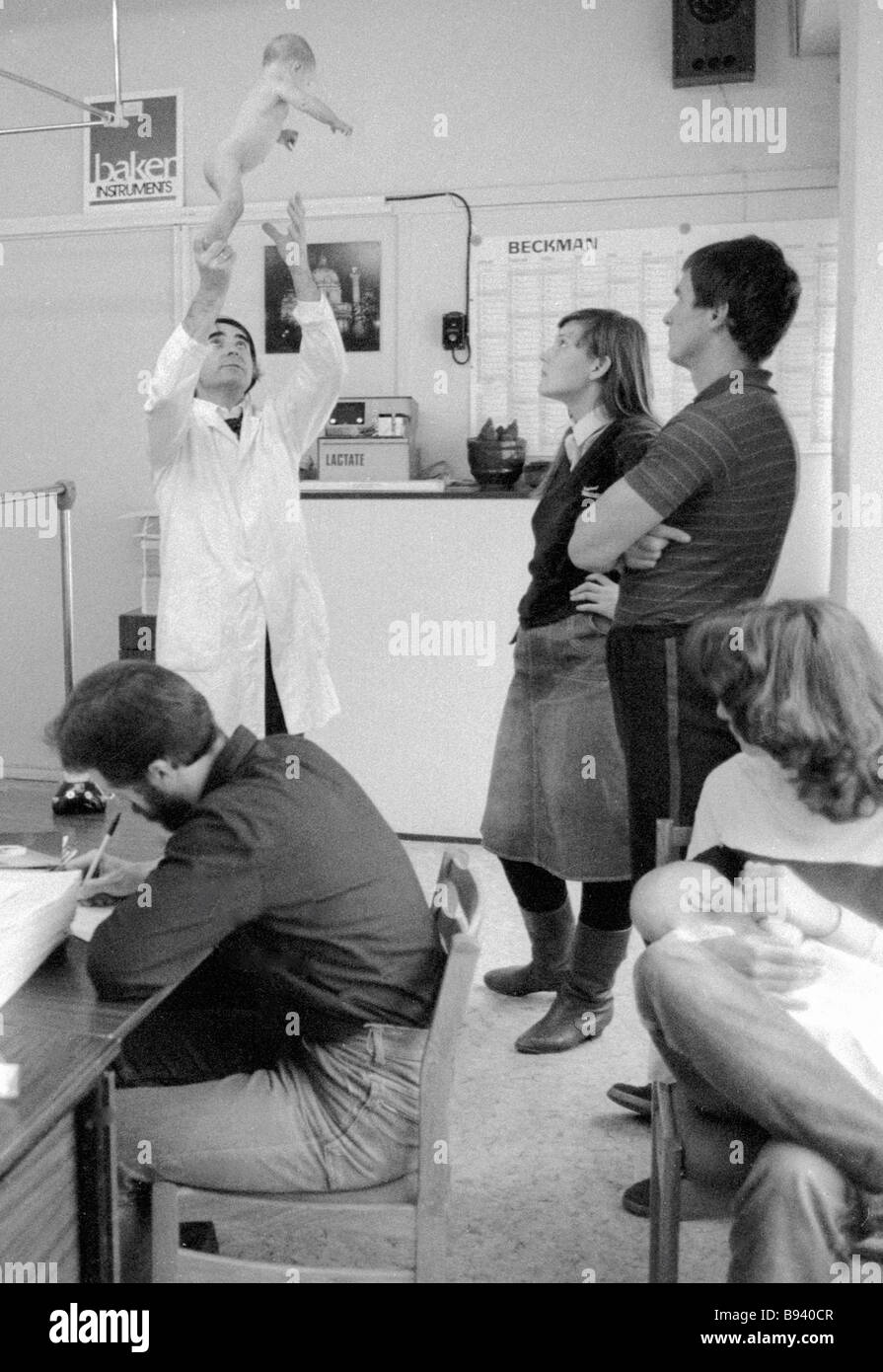 Head of bioenergetics laboratory Igor Charkovsky standing left checks ...