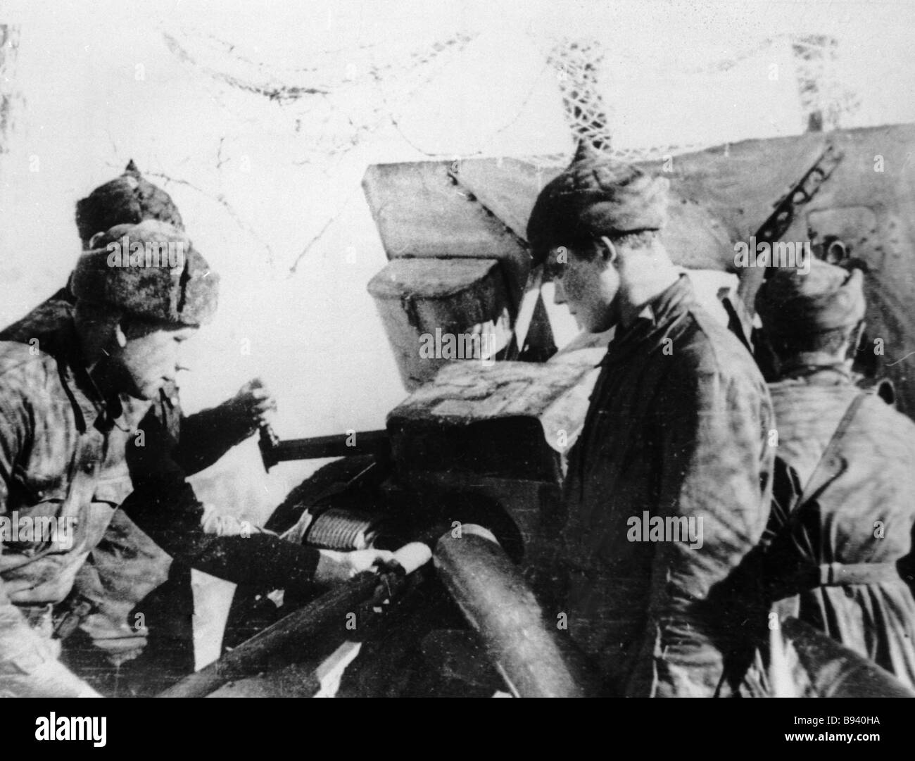 Soviet artillerymen firing at the Finish location during the Soviet ...