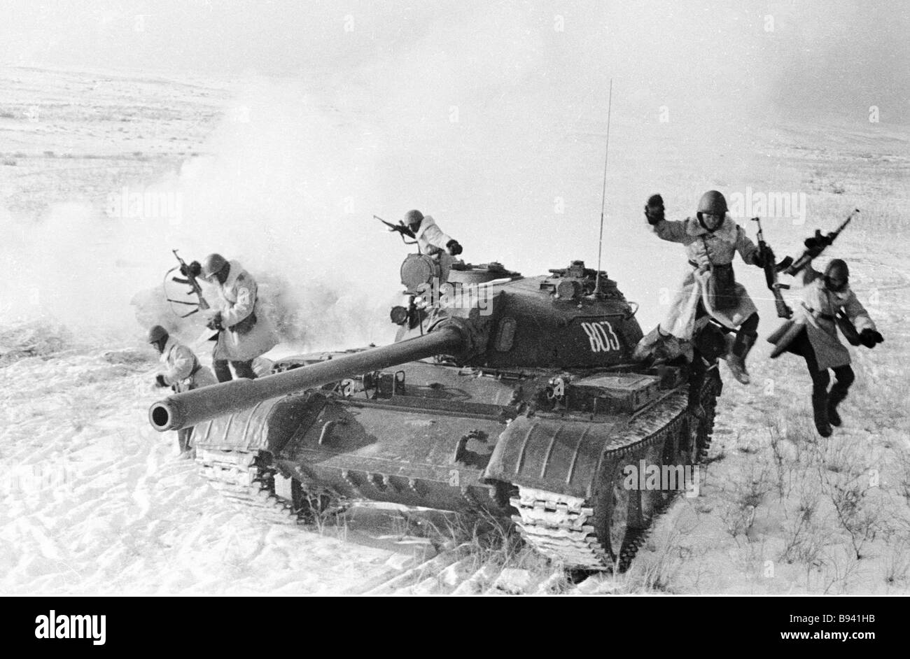 Motorized riflemen jumping from a tank in the Central Asian military ...