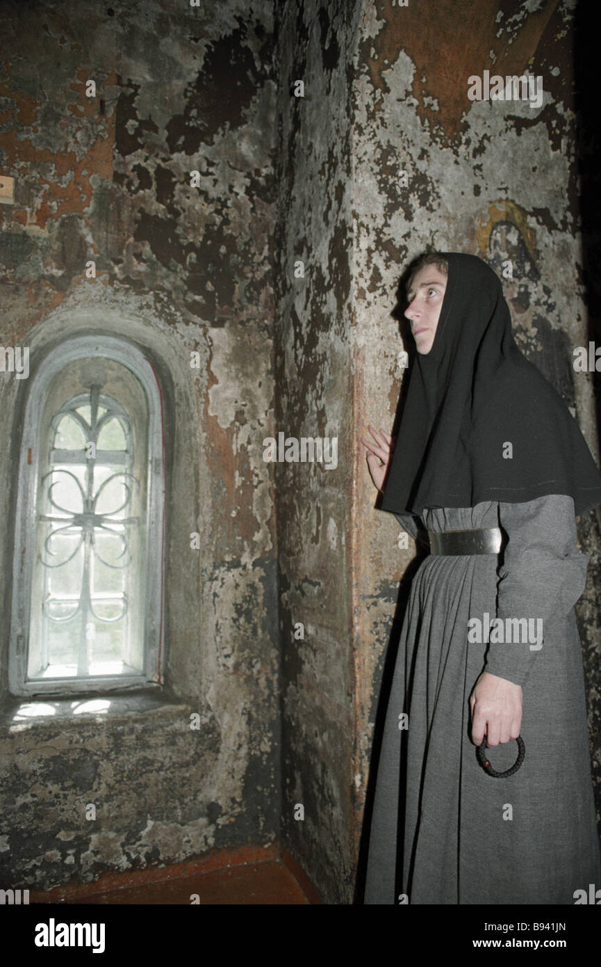 Nun Sergia praying in her cell Stock Photo - Alamy