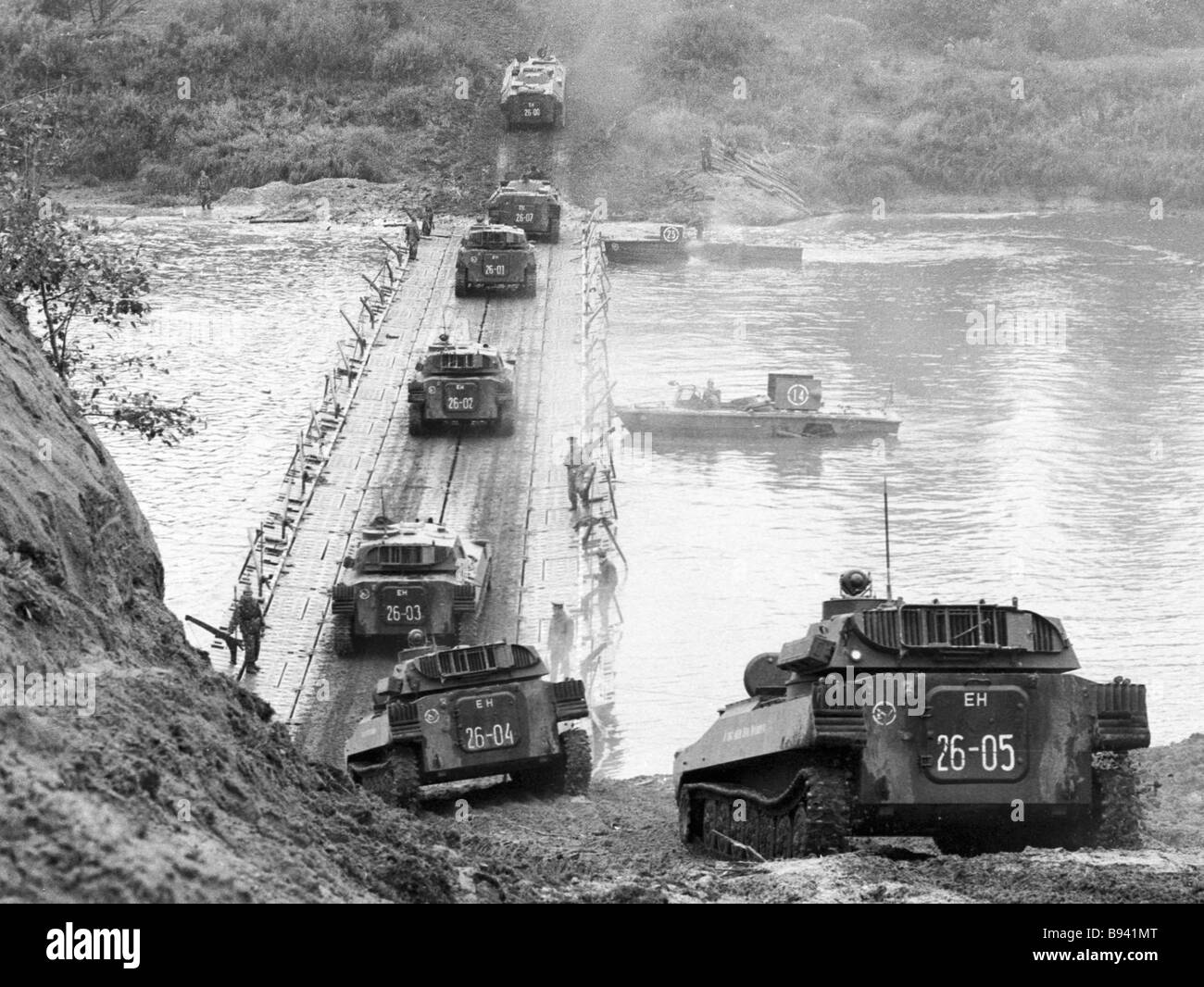 Self propelled artillery crossing the river on a bridge of boats West ...