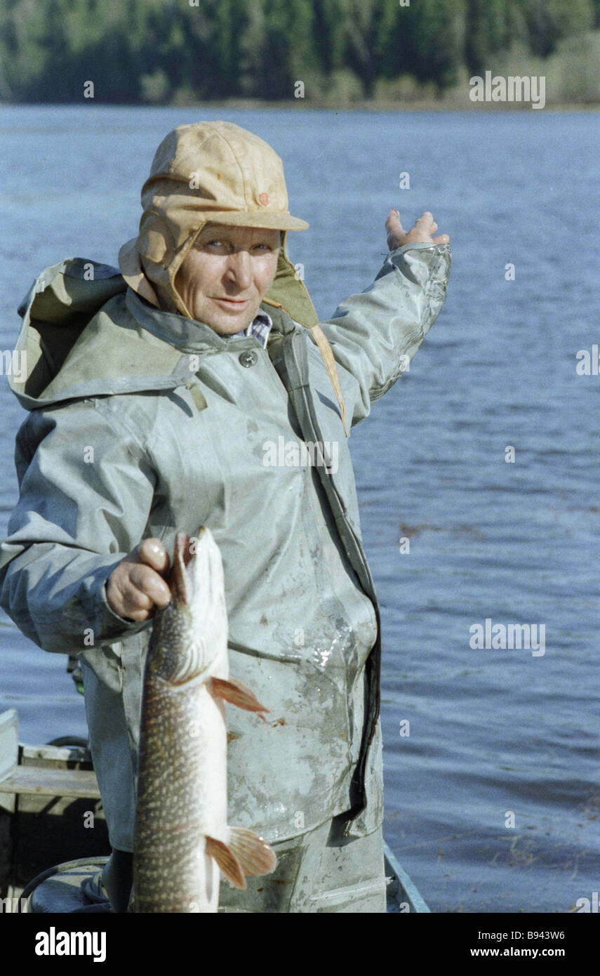 A fishing team foreman shows the catch Stock Photo - Alamy