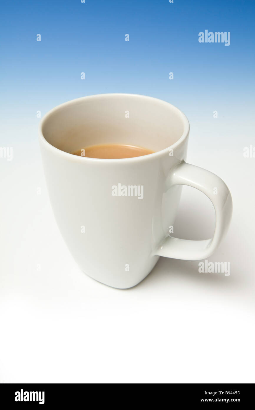 Mug of coffee on a blue studio background Stock Photo - Alamy
