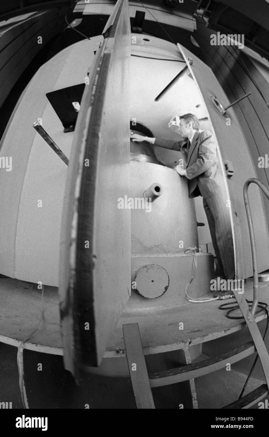 Worker at the High Pressure Physics Institute assembling a high ...