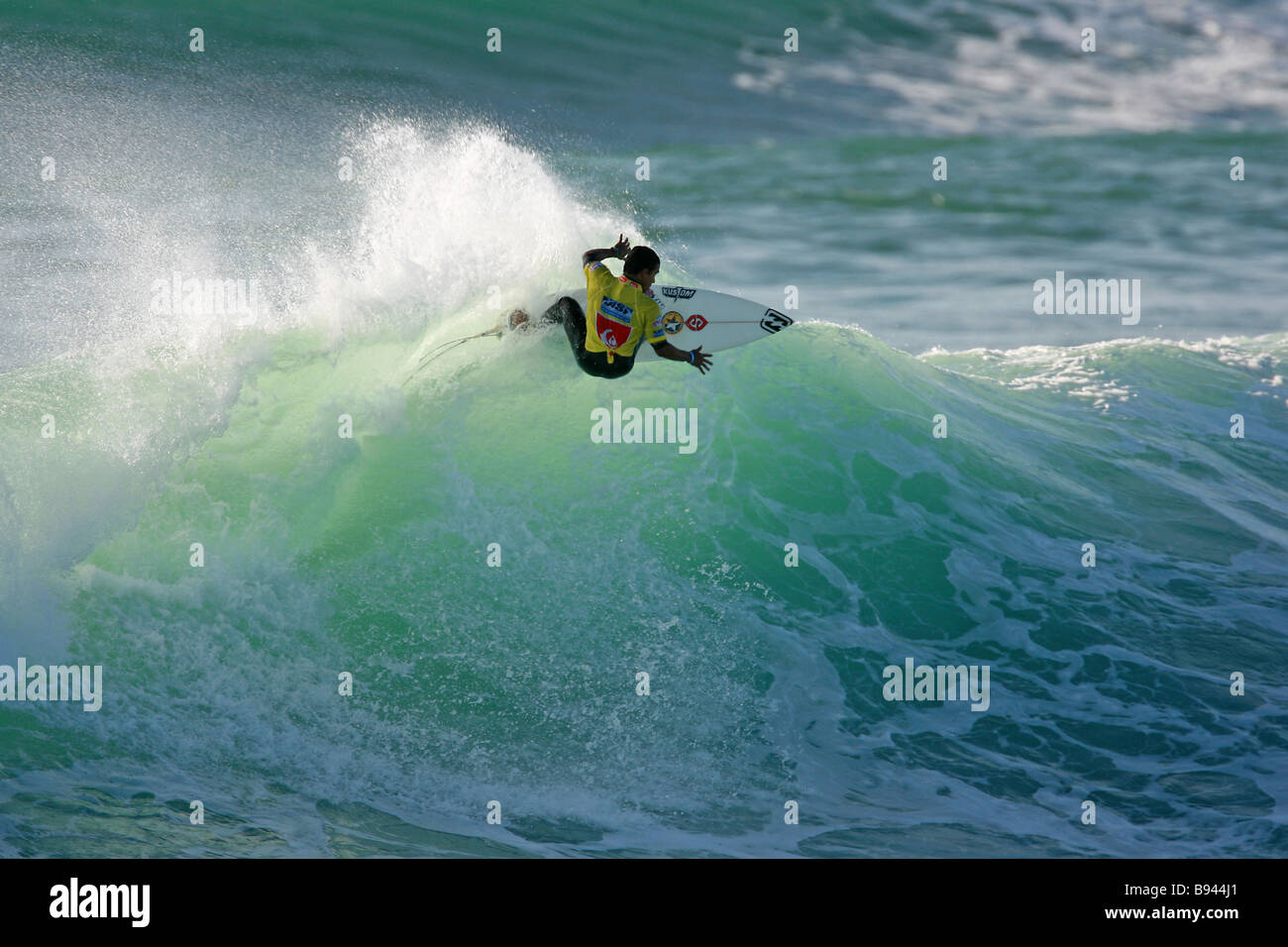A Surfer riding a wave Stock Photo - Alamy
