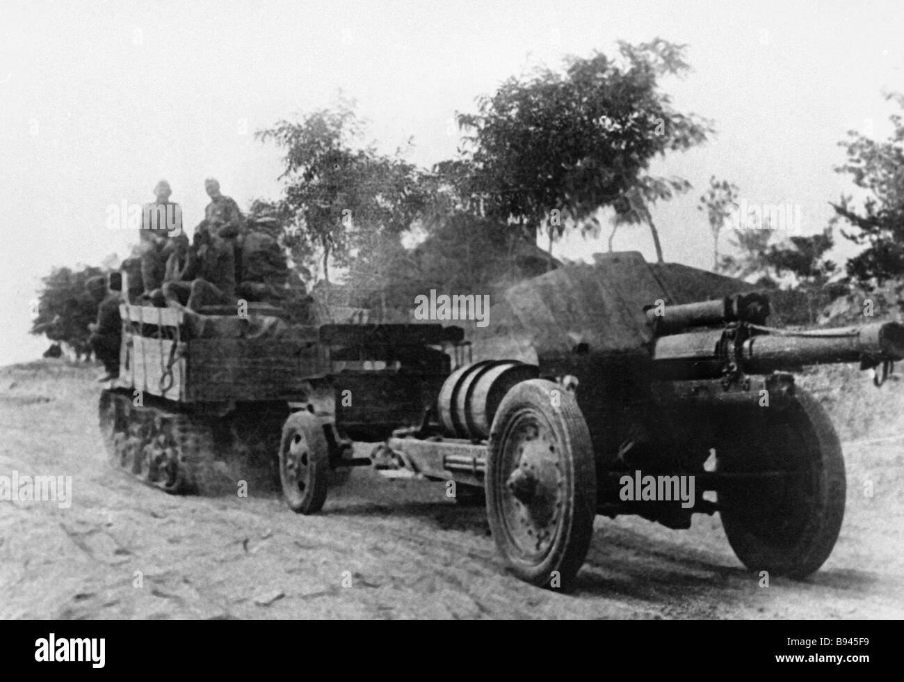 A towing vehicle pulling an artillery gun Stock Photo - Alamy